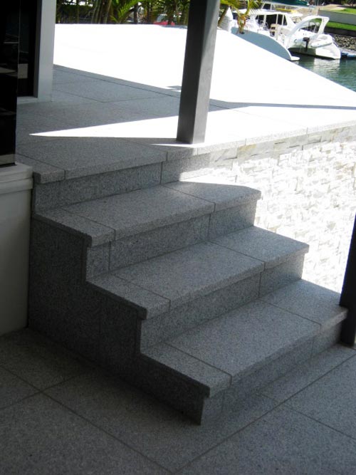 Closeup of Light Grey Granite Stone tiles when used for staircase